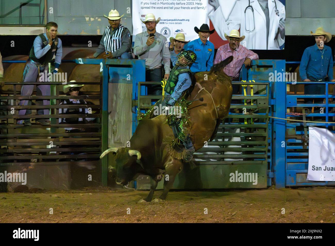 Professional rodeo cowboy Josh Frost successfully rides a bull in a ...