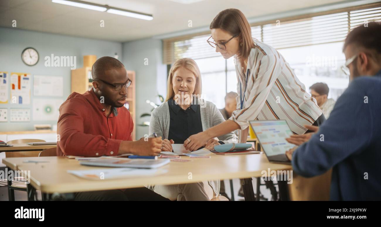 Grown-Up Men and Women Working in Groups for an Assignment in Specialty ...