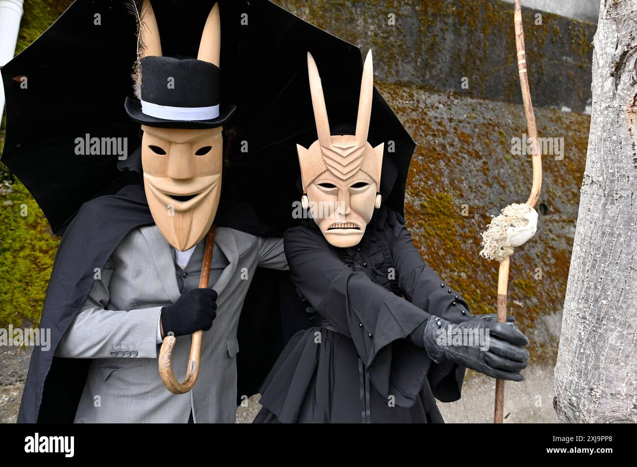 A traditional mask from Lazarim, Portugal, intricately carved from wood ...