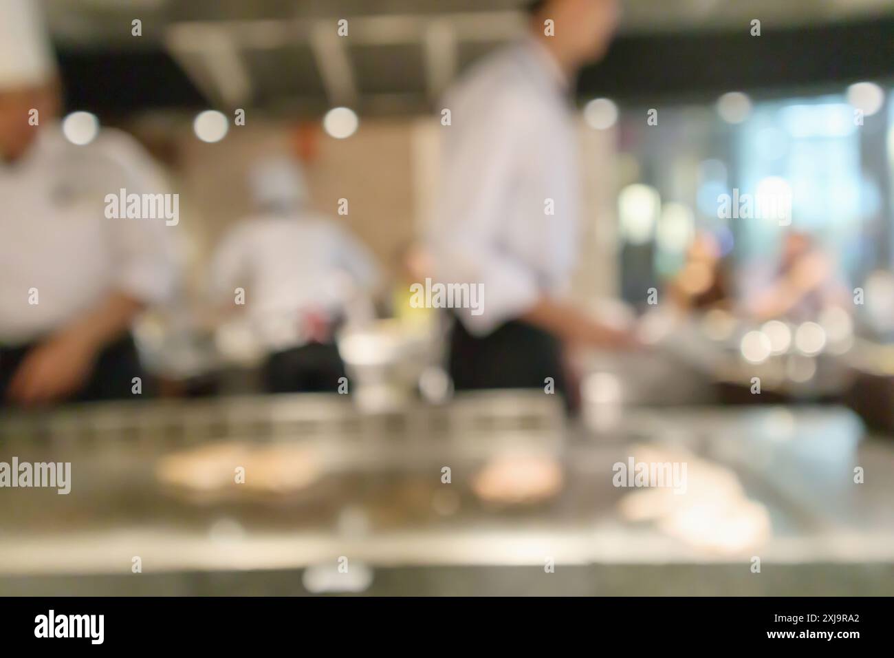 Chef cooking in restaurant kitchen blurred defocused background Stock ...