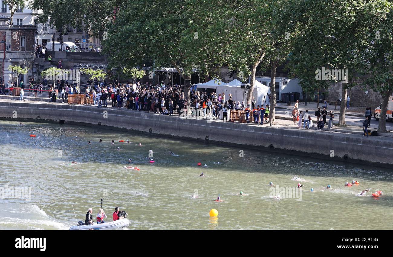 PARIS, July 17, 2024 -- Local residents swim in the Seine River after ...