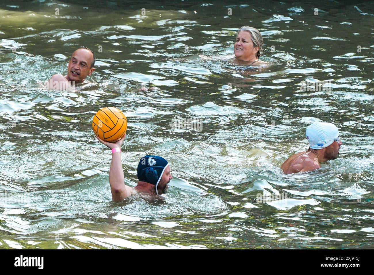 PARIS, July 17, 2024 -- Local residents swim in the Seine River after ...