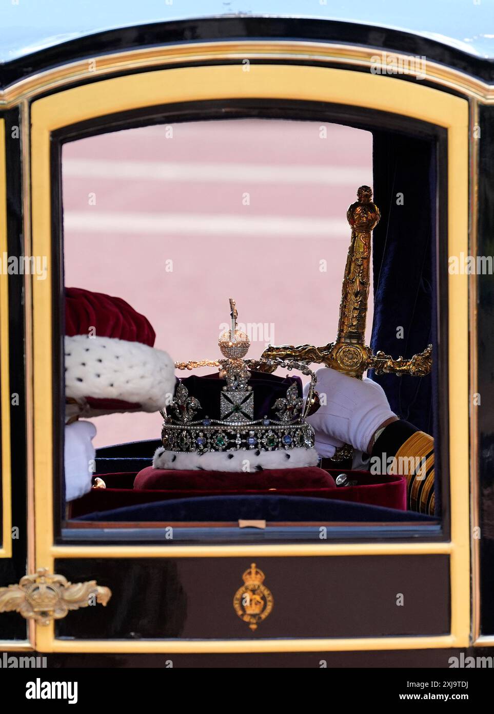 Queen Alexandra's State Coach, carrying the Imperial State Crown, the ...