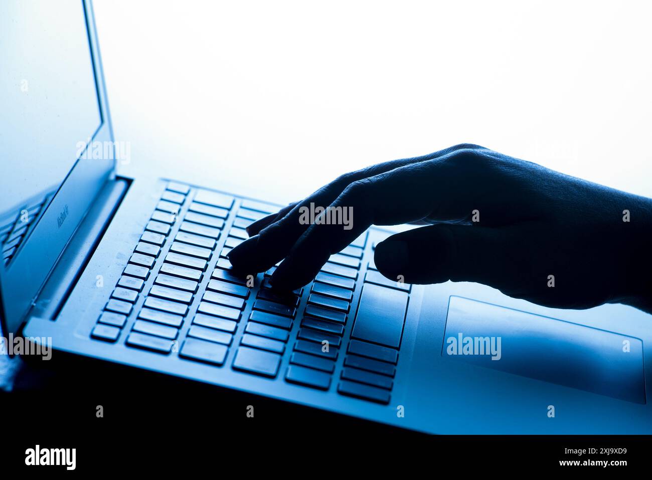 File photo dated 04/03/17 of a woman's hand pressing keys of a laptop ...