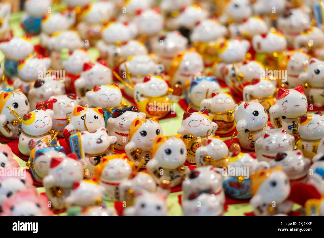 Traditional Waving Cat Statues, Also Known as Maneki-neko Stock Photo ...