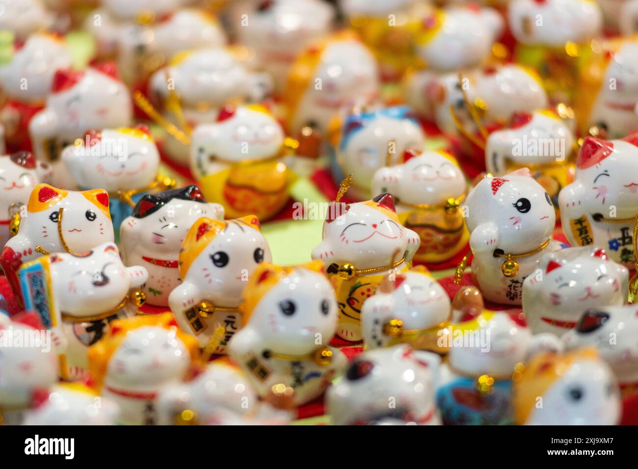 Traditional Waving Cat Statues, Also Known as Maneki-neko Stock Photo ...