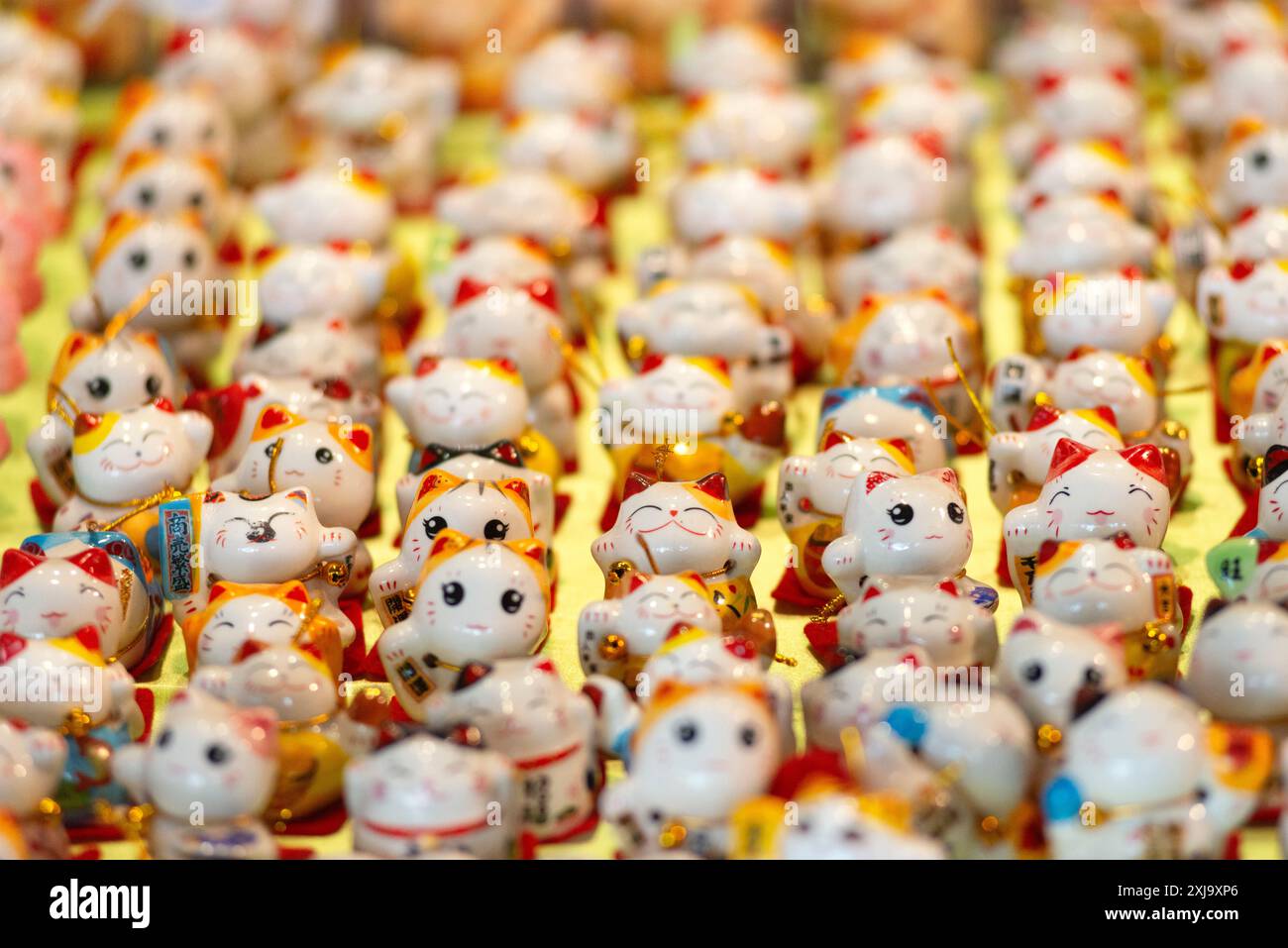 Traditional Waving Cat Statues, Also Known as Maneki-neko Stock Photo ...