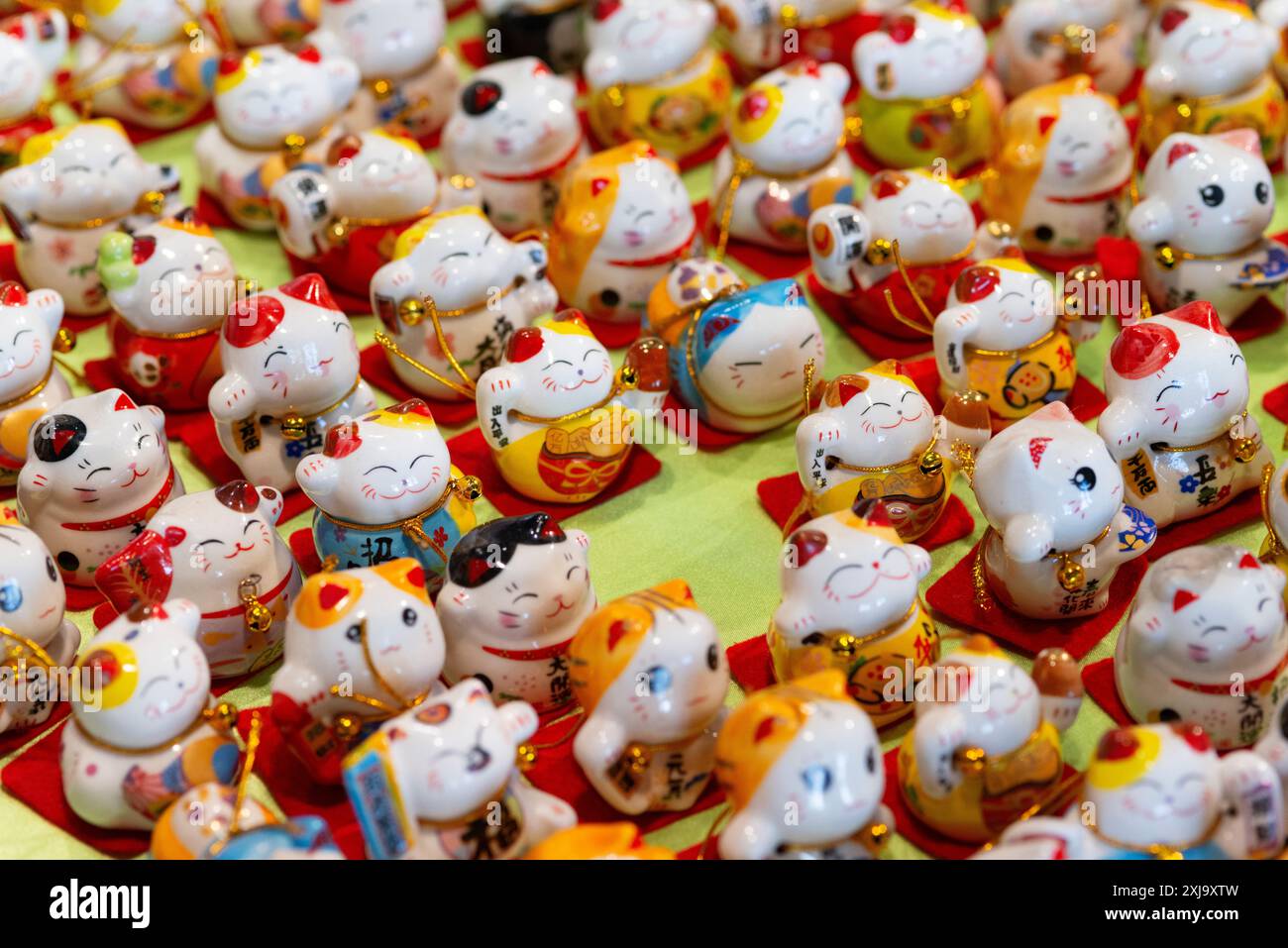 Traditional Waving Cat Statues, Also Known as Maneki-neko Stock Photo ...