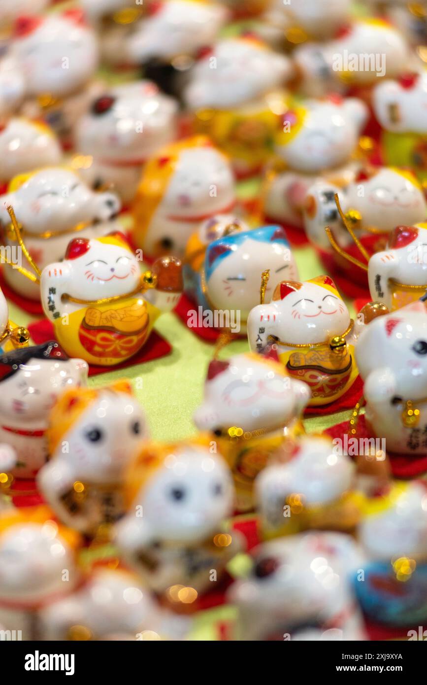 Traditional Waving Cat Statues, Also Known as Maneki-neko Stock Photo ...