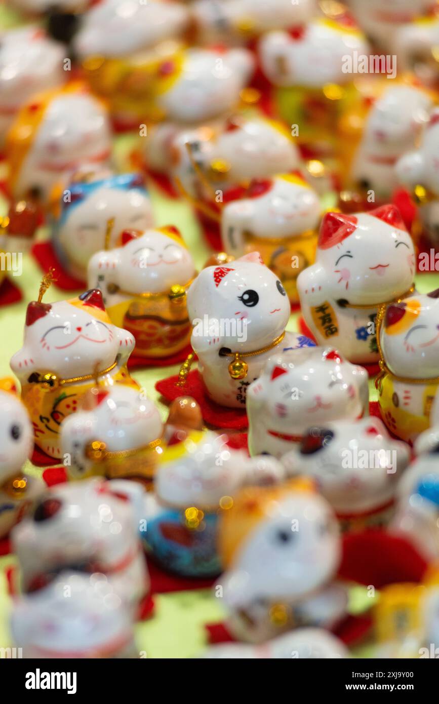 Traditional Waving Cat Statues, Also Known as Maneki-neko Stock Photo ...