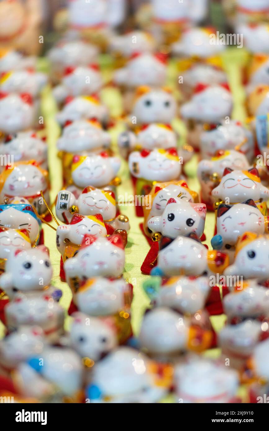 Traditional Waving Cat Statues, Also Known as Maneki-neko Stock Photo ...