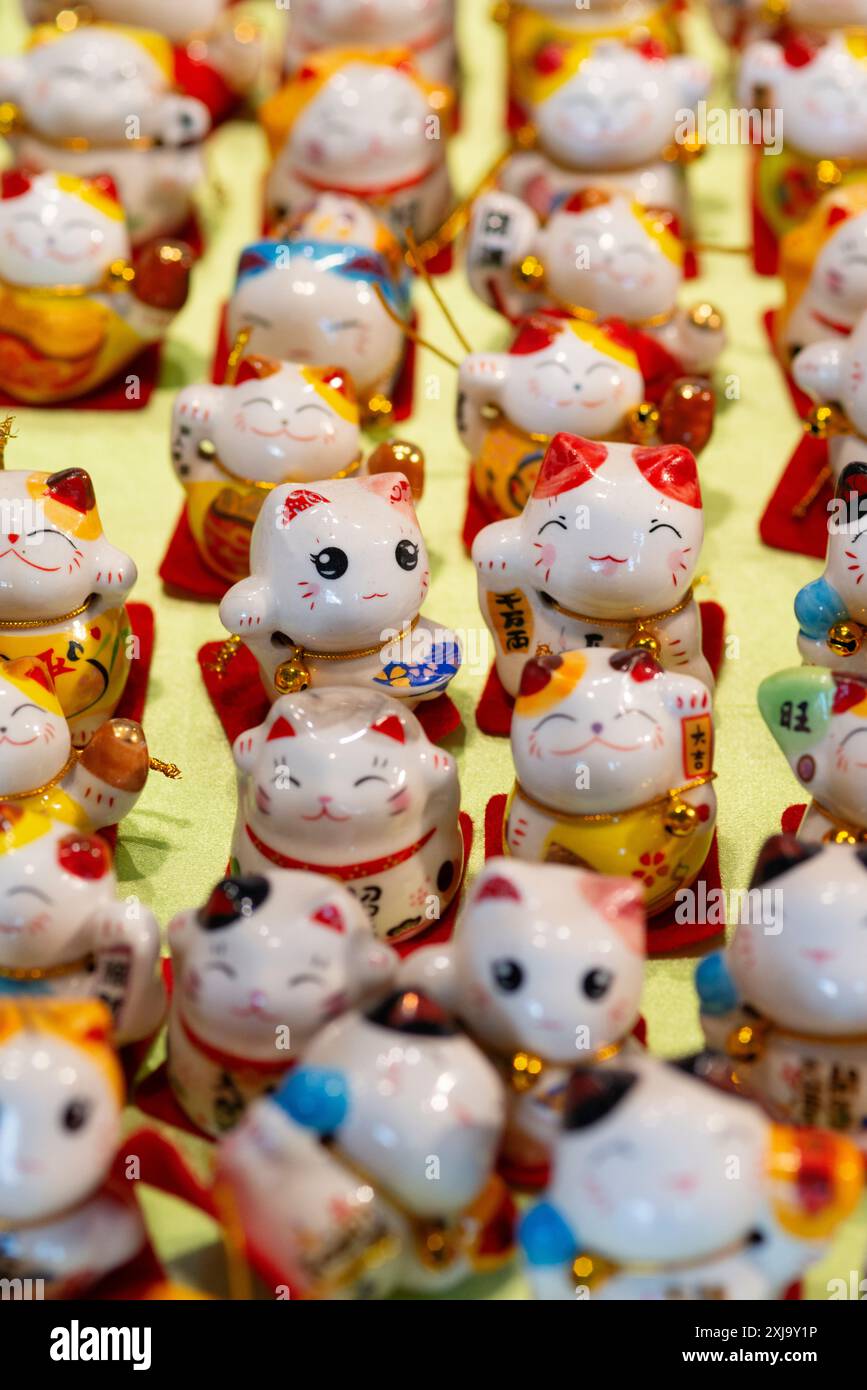 Traditional Waving Cat Statues, Also Known as Maneki-neko Stock Photo ...