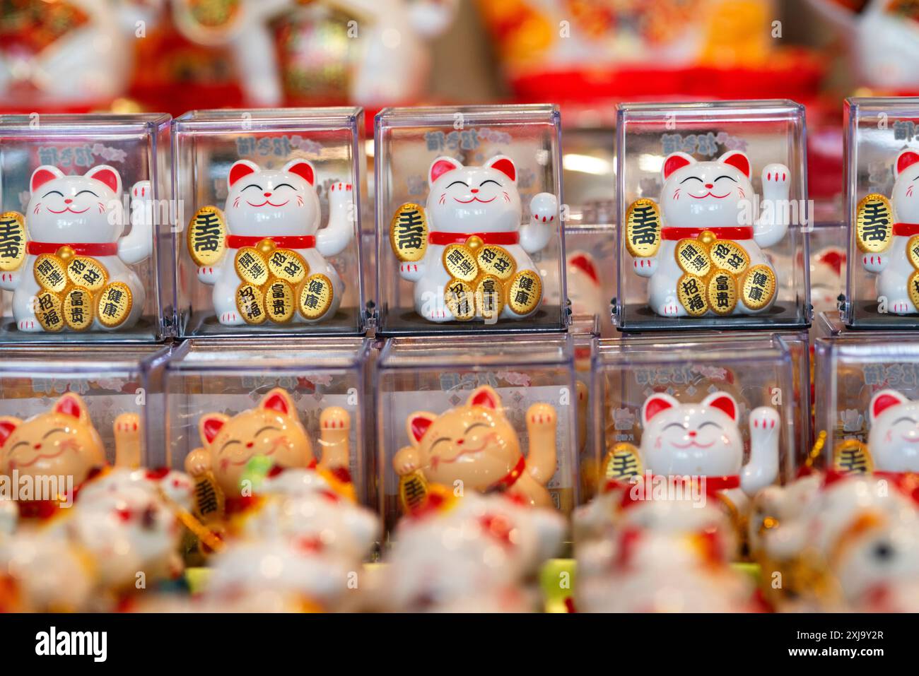 Traditional Waving Cat Statues, Also Known as Maneki-neko Stock Photo ...