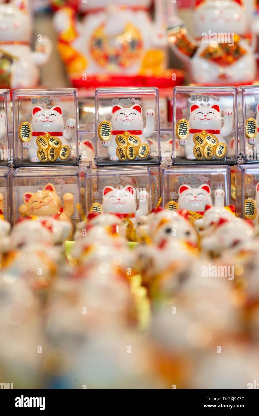 Traditional Waving Cat Statues, Also Known as Maneki-neko Stock Photo ...