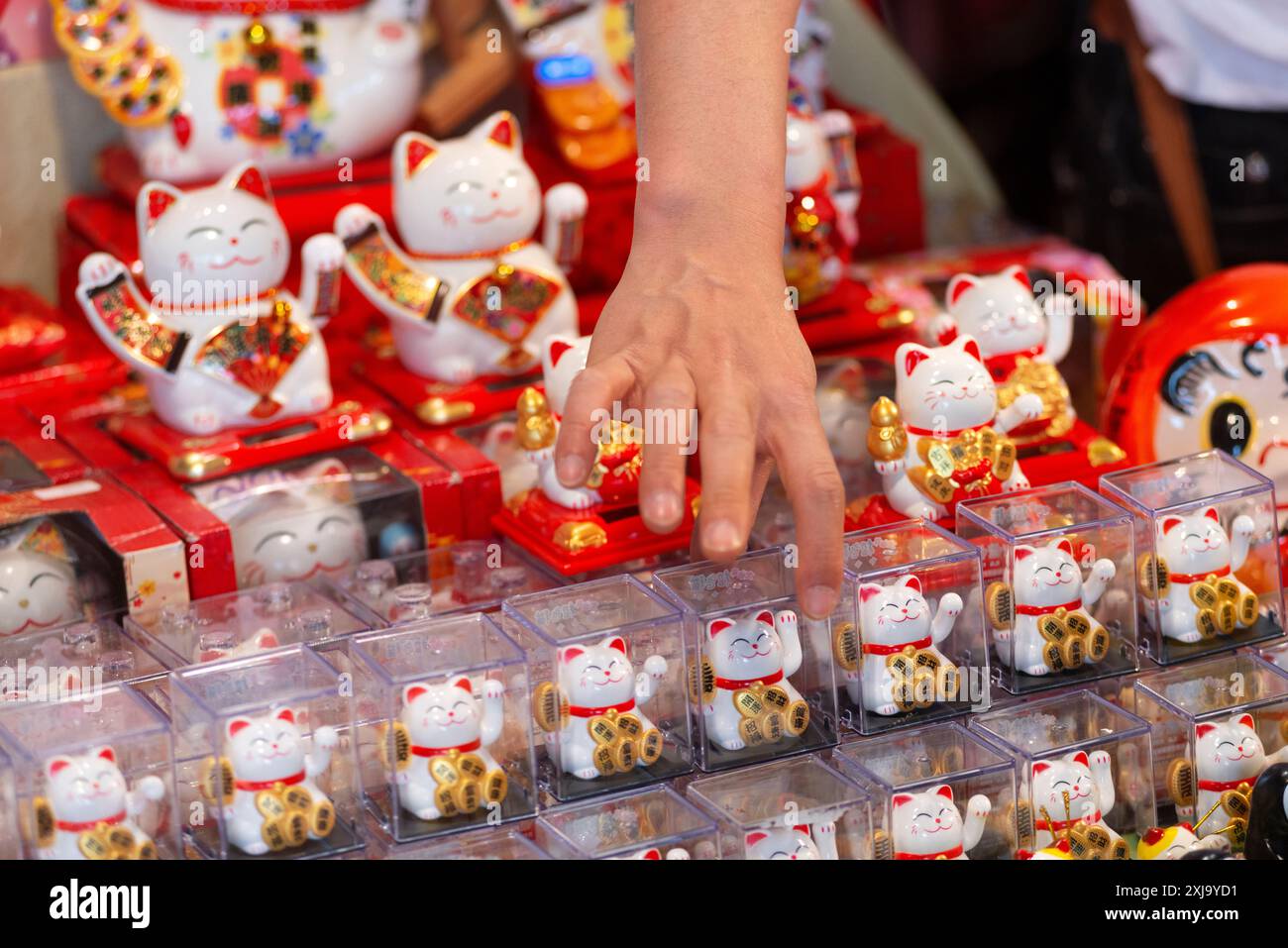 Traditional Waving Cat Statues, Also Known as Maneki-neko Stock Photo ...