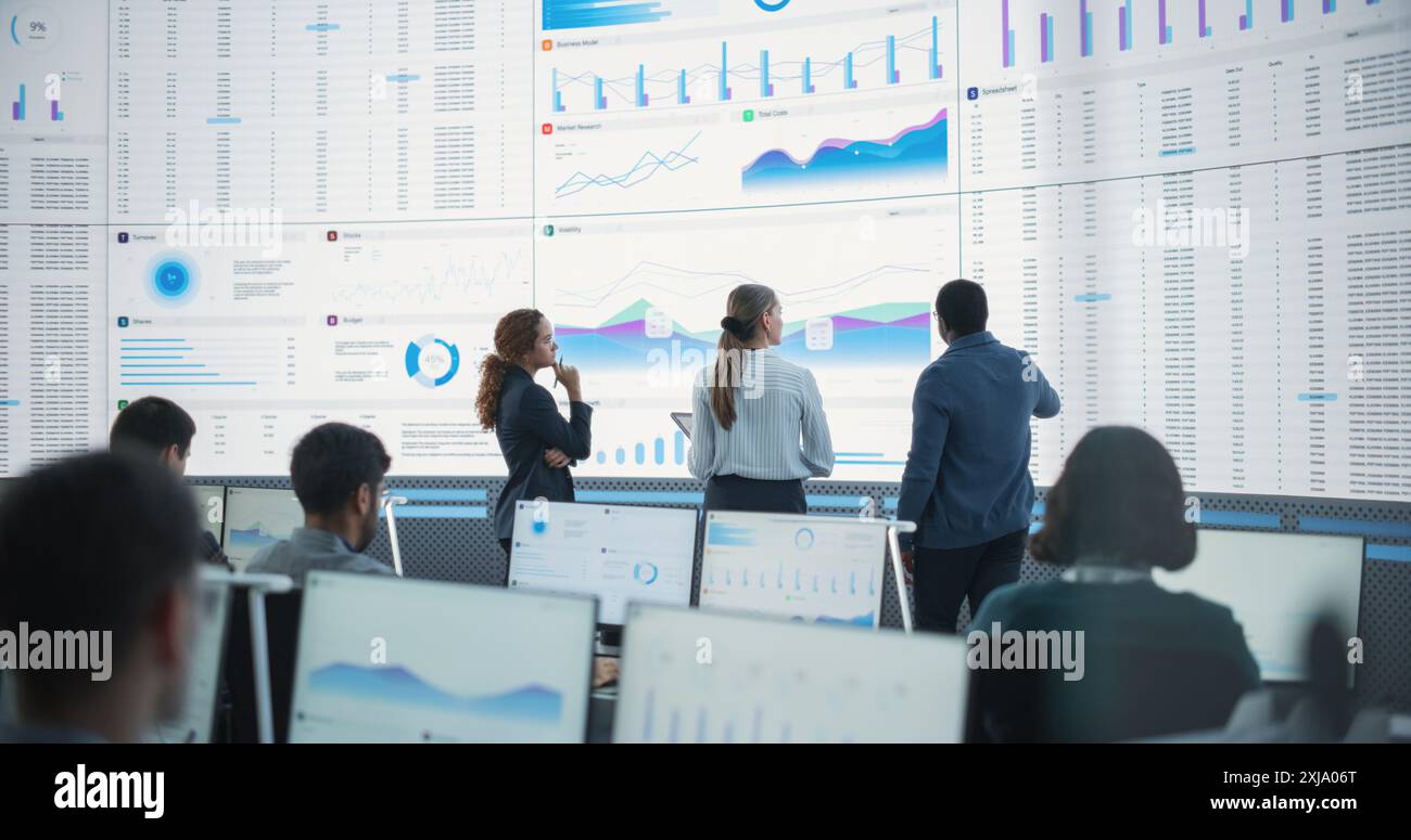Data scientists meeting in monitoring hi-res stock photography and ...