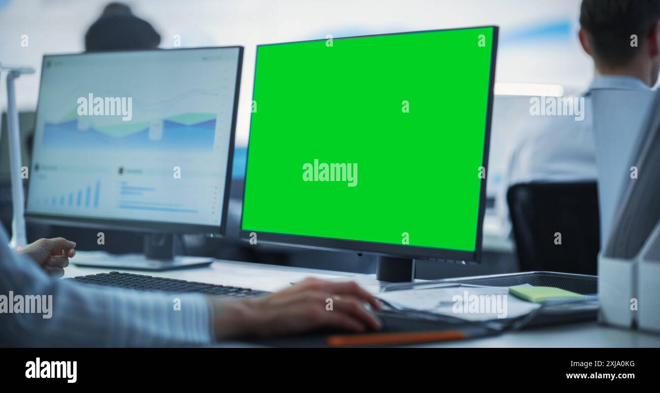 Close Up on Computer Monitor Green Screen Display in a Business Office ...