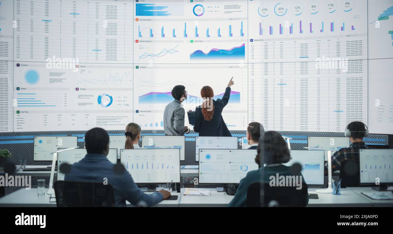 Back View Of Indian Data Analyst And Hispanic Manager Discussing ...