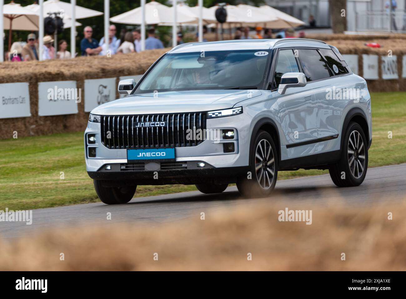2024 Omoda Jaecoo 7 driving up the hill climb track at the Goodwood ...