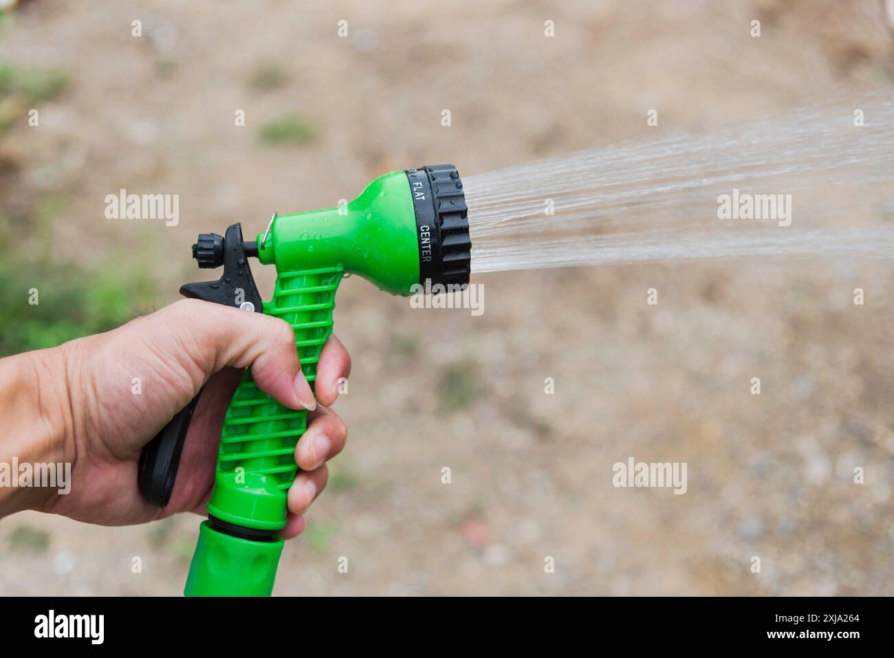 Plastic Trigger Nozzle for spray the water to the tree Stock Photo - Alamy