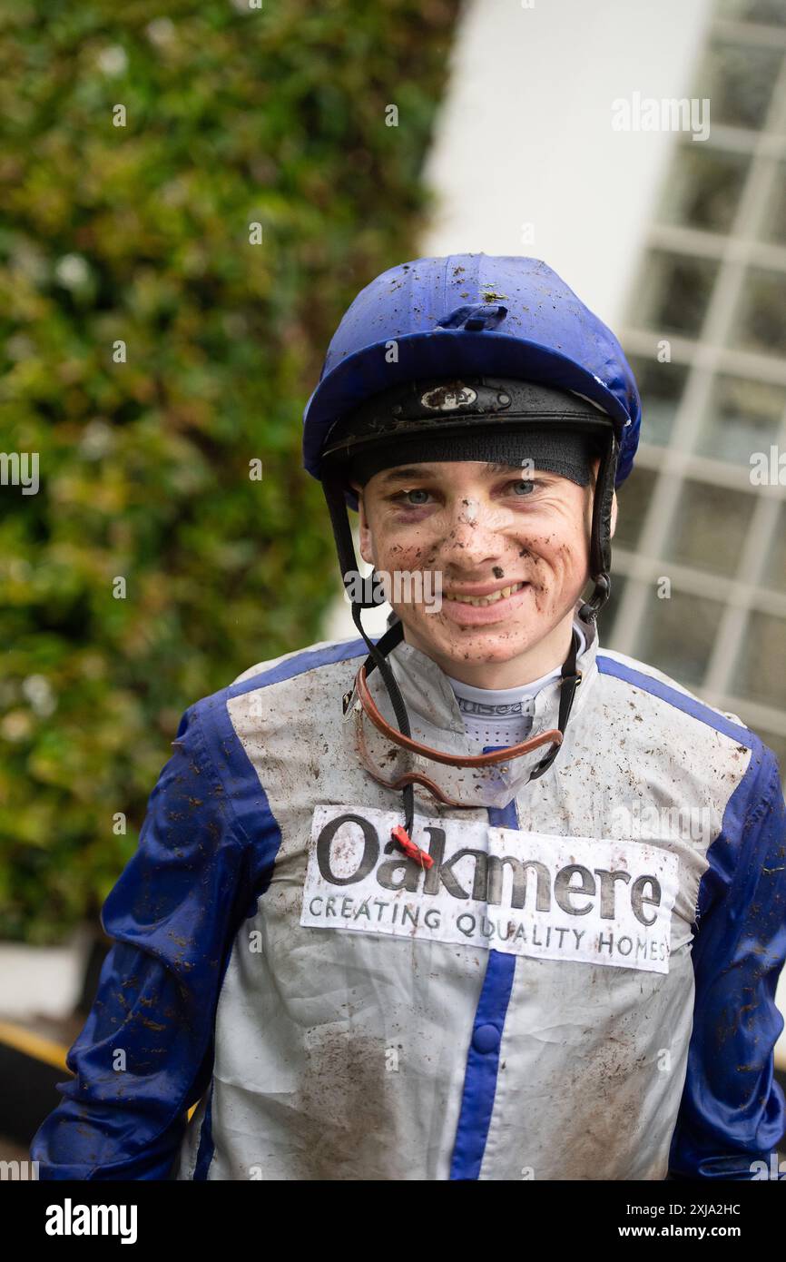 Windsor, Berkshire, UK. 15th July, 2024. A muddy but smiling Jockey ...