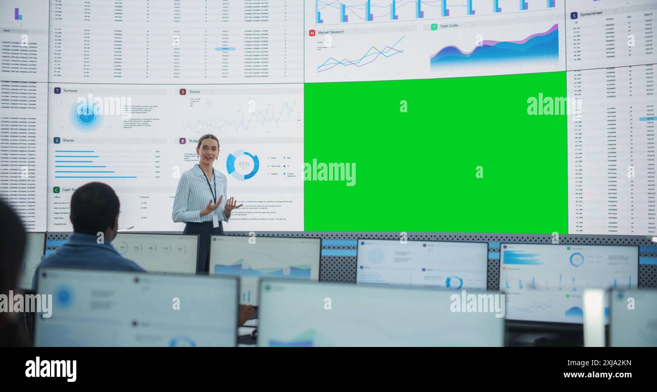Caucasian Female Data Scientist Giving Presentation On Big Digital Screen With Green Screen ...