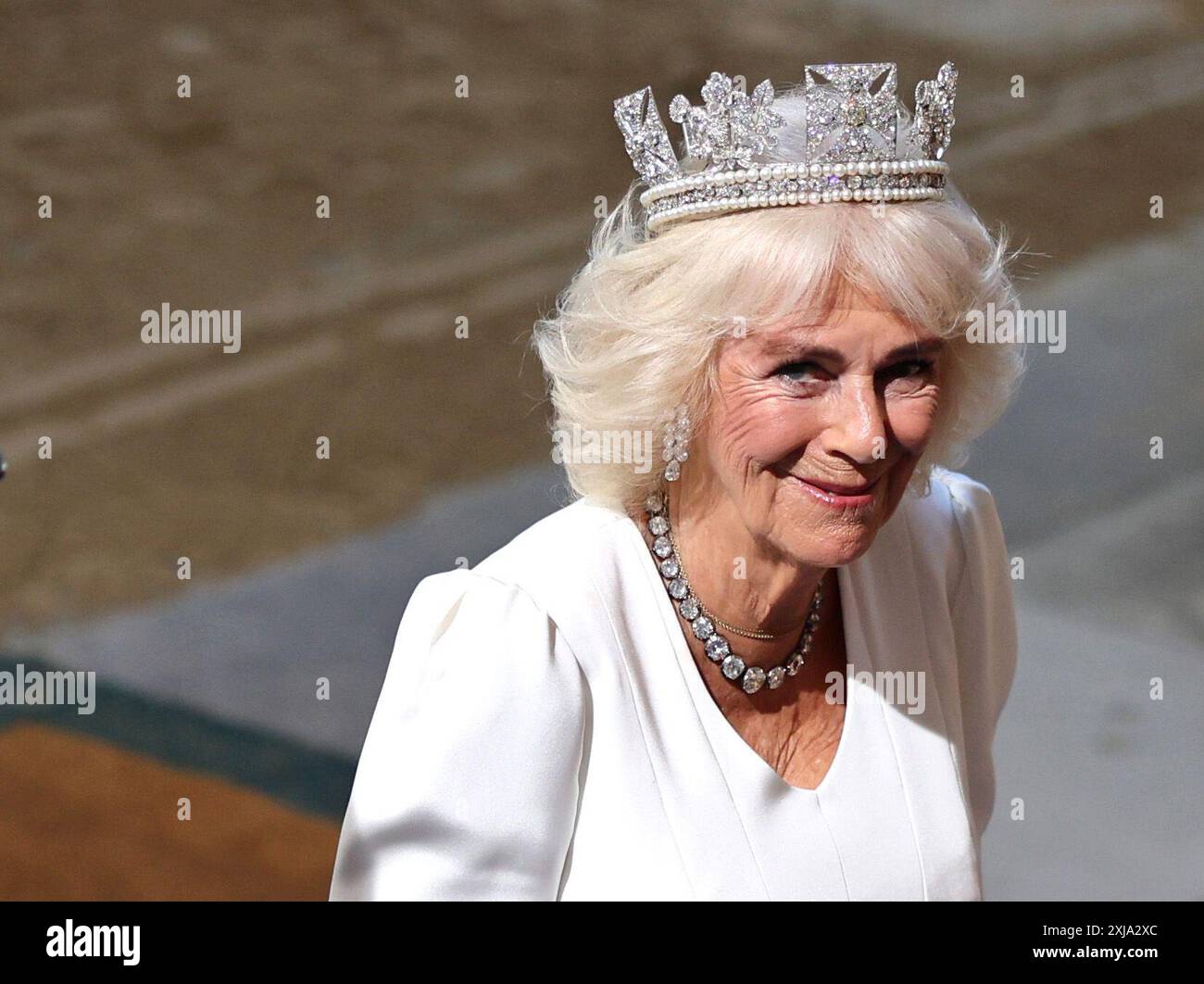 Queen Camilla, wearing the George IV State Diadem, arrives for the ...