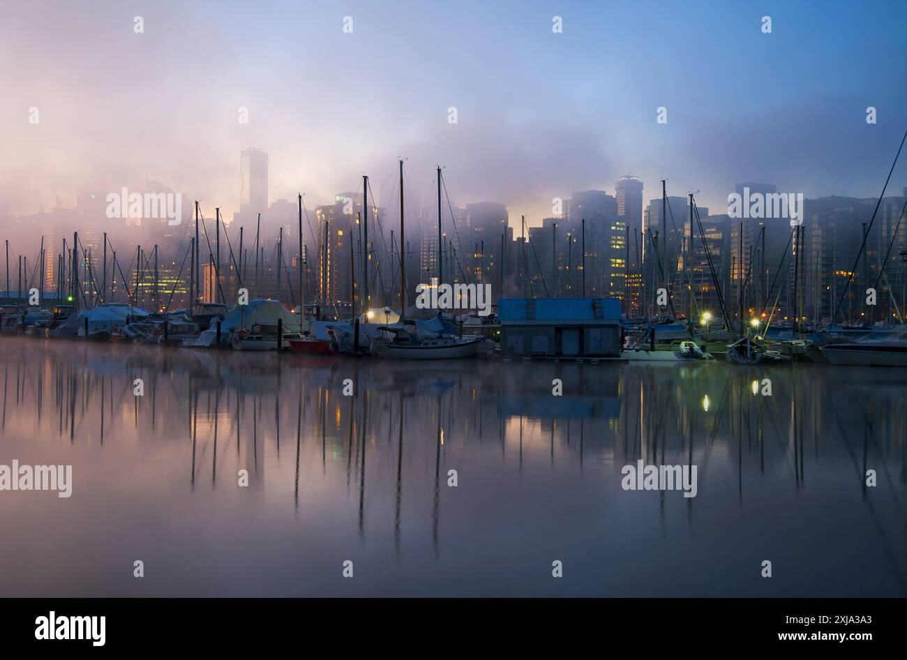 The view from Stanley Park in the early morning with mist rising from ...