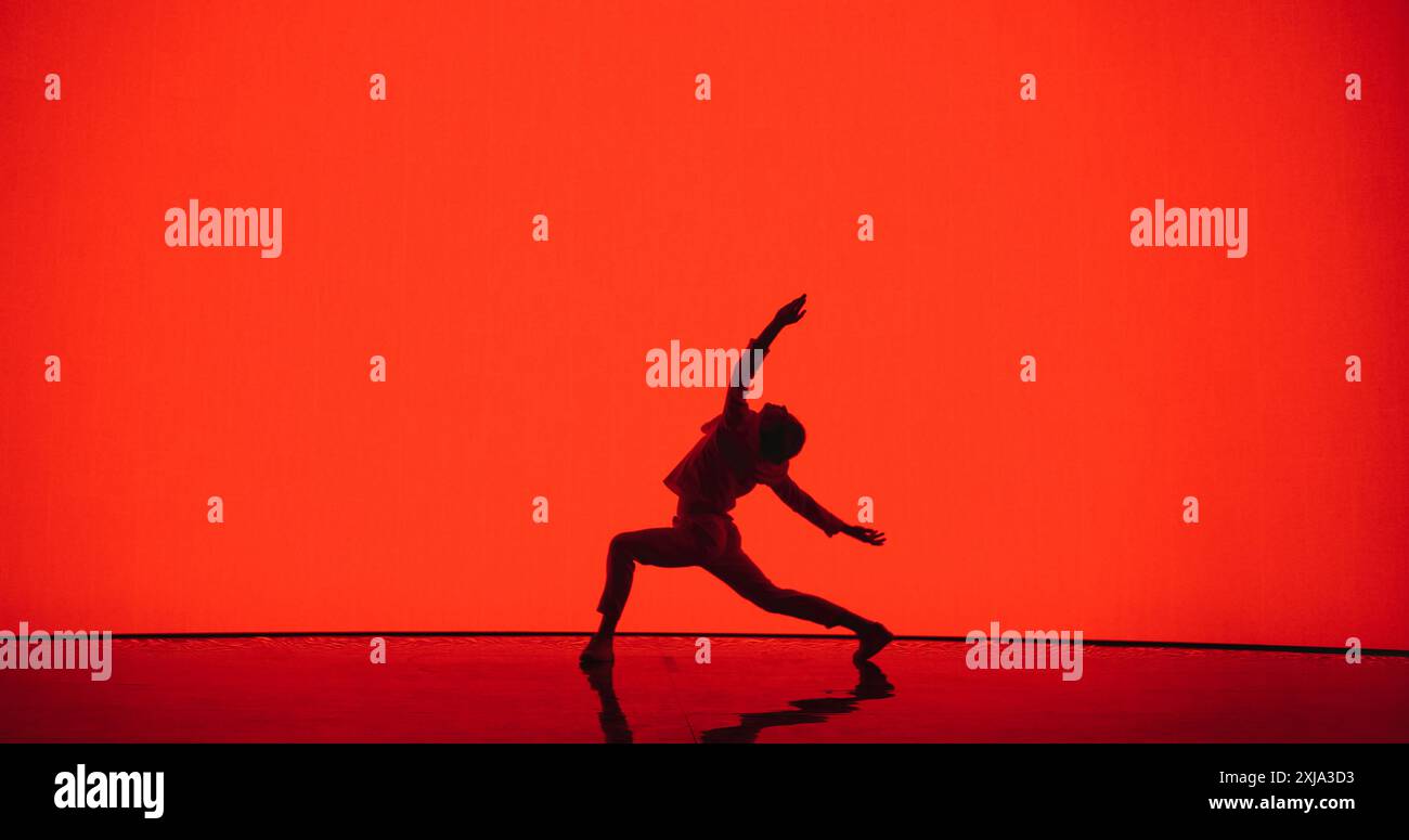 Male Dancer in White Clothes Unleashing an Energetic Fusion of Styles ...