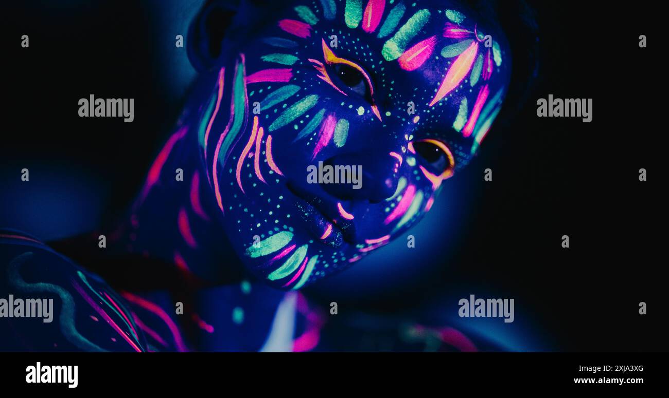 Captivating Beauty Shoot: Young Female Model with Neon Body Art Paint ...