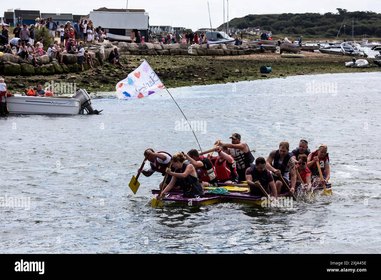 Mudeford RNLI fun day, charity event raft race in the harbour Stock ...
