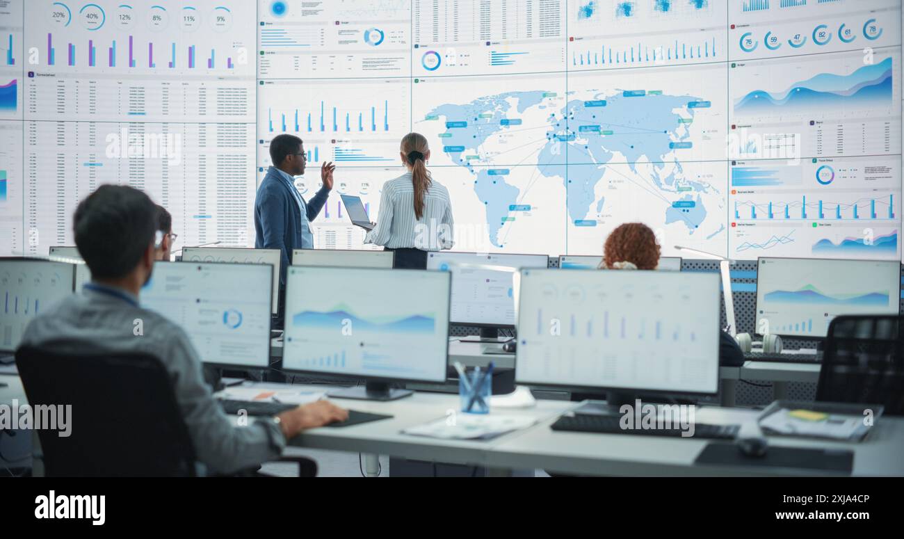 Back View Of Black Male Analyst Talking To Caucasian Female Manager In ...