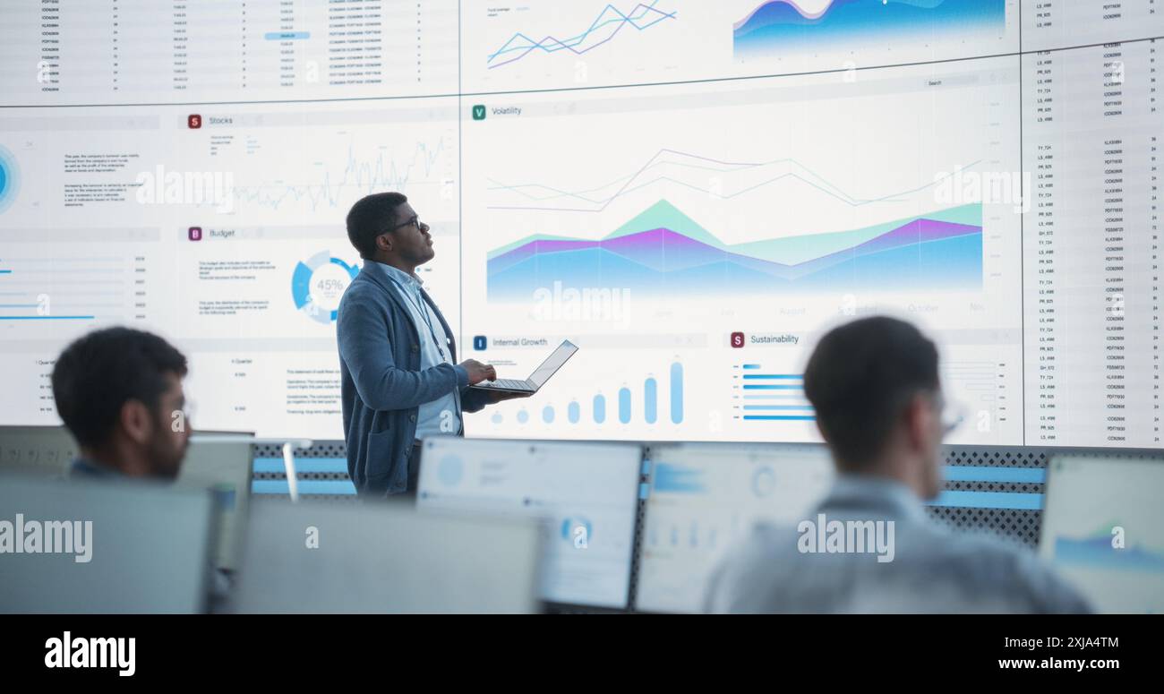 Business professional studying financial graphs hi-res stock ...