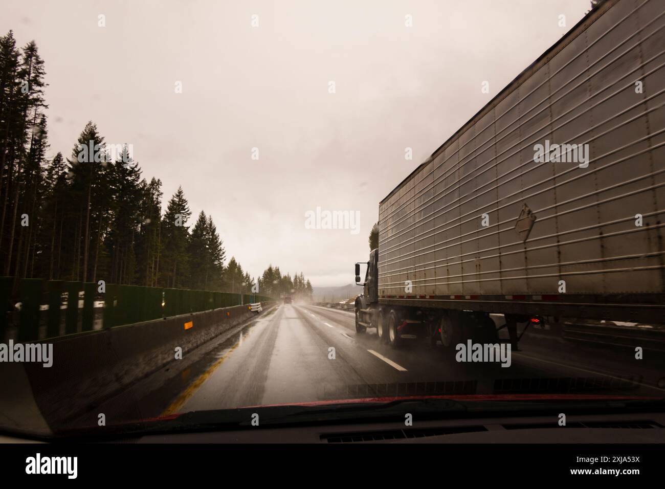 Driver's perspective through windshield of winter highway with semi ...