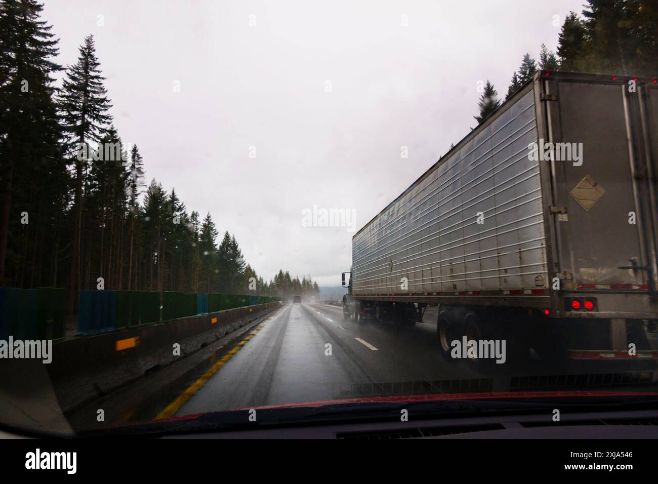 Driver's perspective through windshield of winter highway with semi ...