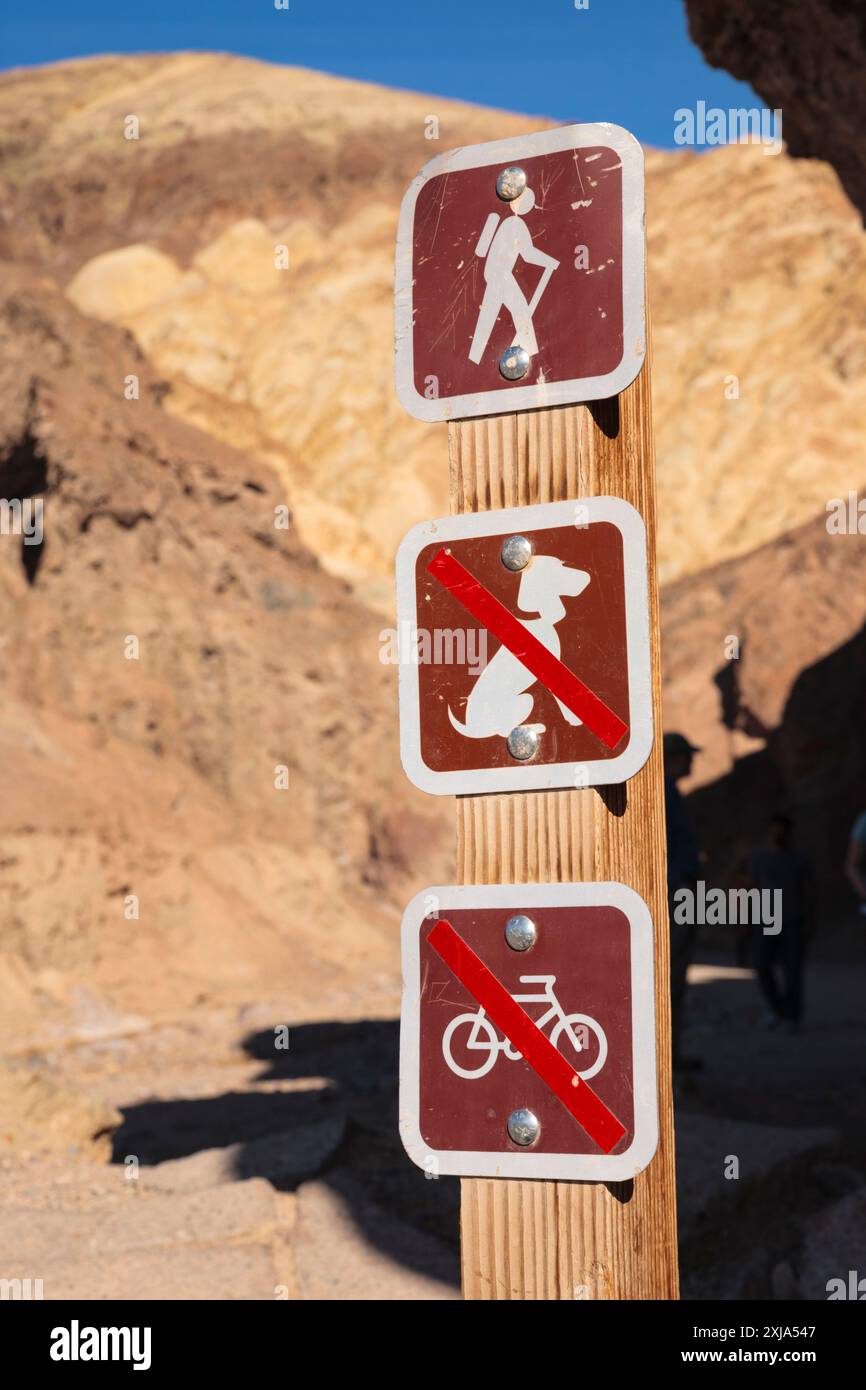 Signs on a walking trail in a national park. No Dogs and No Bicycles ...
