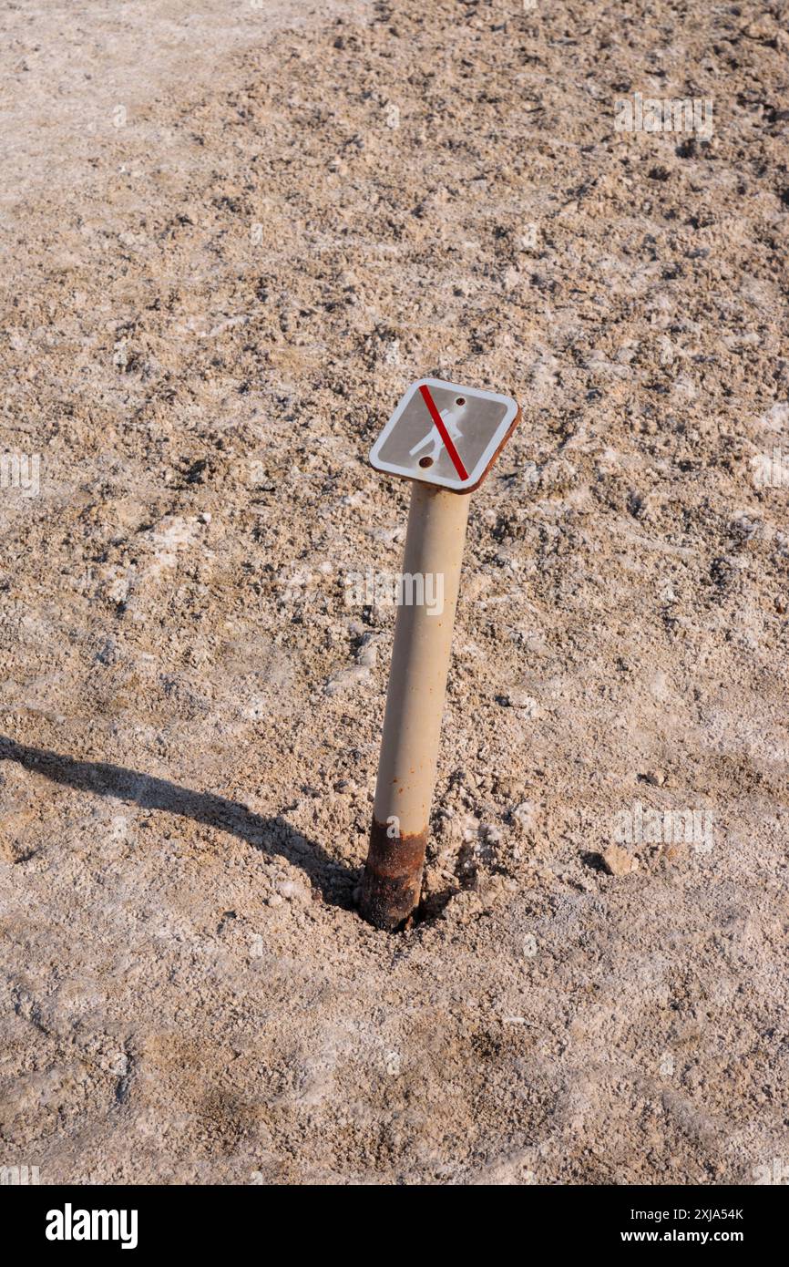 No walking sign beside the pathway, stuck in the sand in Death Valley ...