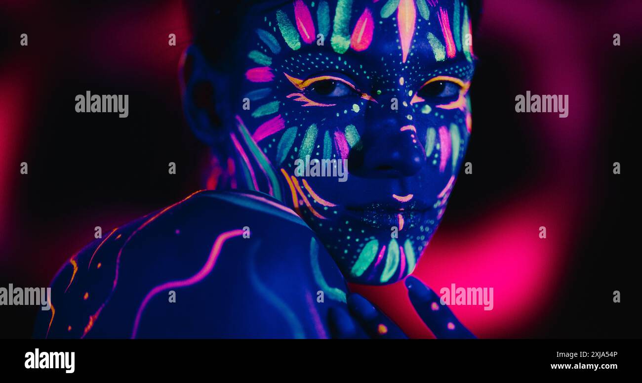 Young Sensual Model Poses with Grace and Poise, Her Vivid Body Paint ...