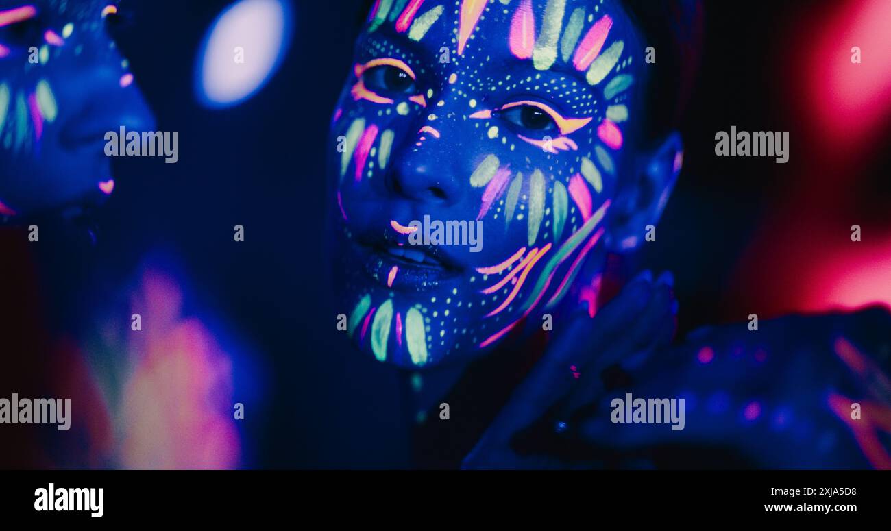 Young Sensual Model Poses with Grace and Poise, Her Vivid Body Paint ...