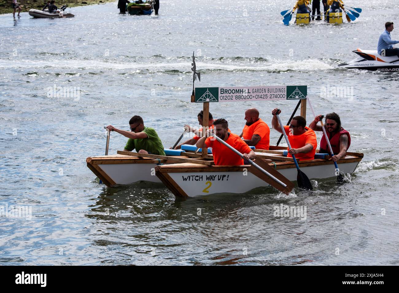 Mudeford RNLI fun day, charity event raft race in the harbour Stock ...
