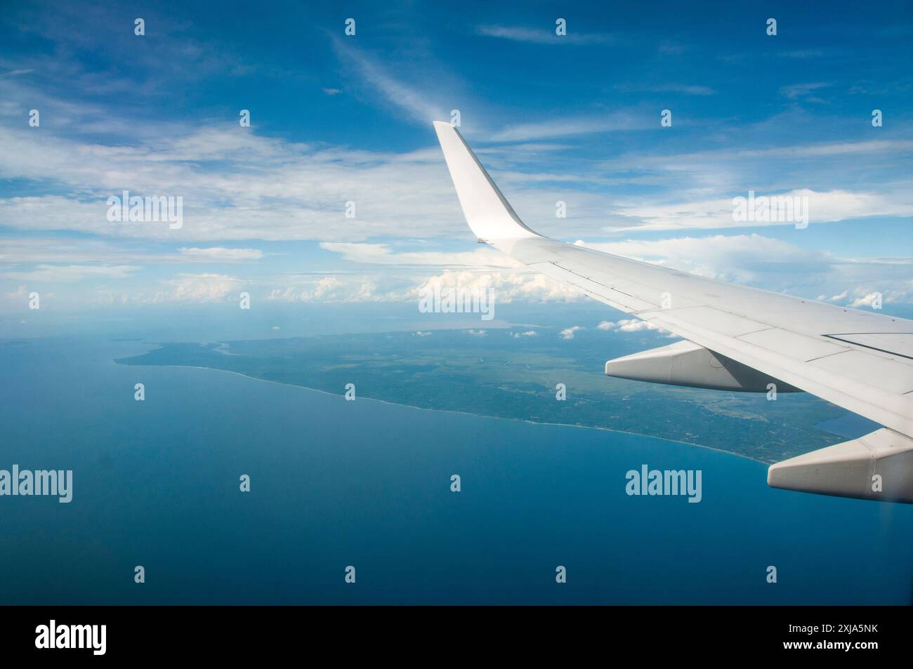 Soaring Skies and a View of Airplane Wings from the Window Stock Photo ...
