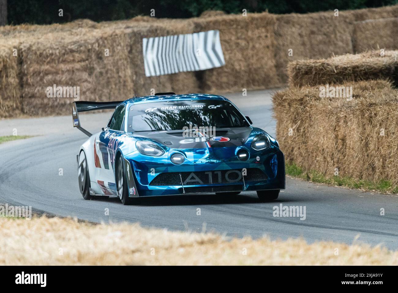 2024 Alpine A110 Pikes Peak car driving up the hill climb track at the ...