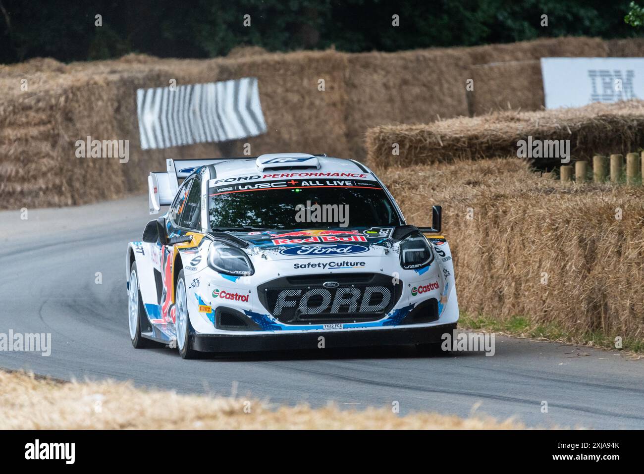 2024 Ford Puma Rally1 Hybrid WRC car driving up the hill climb track at ...