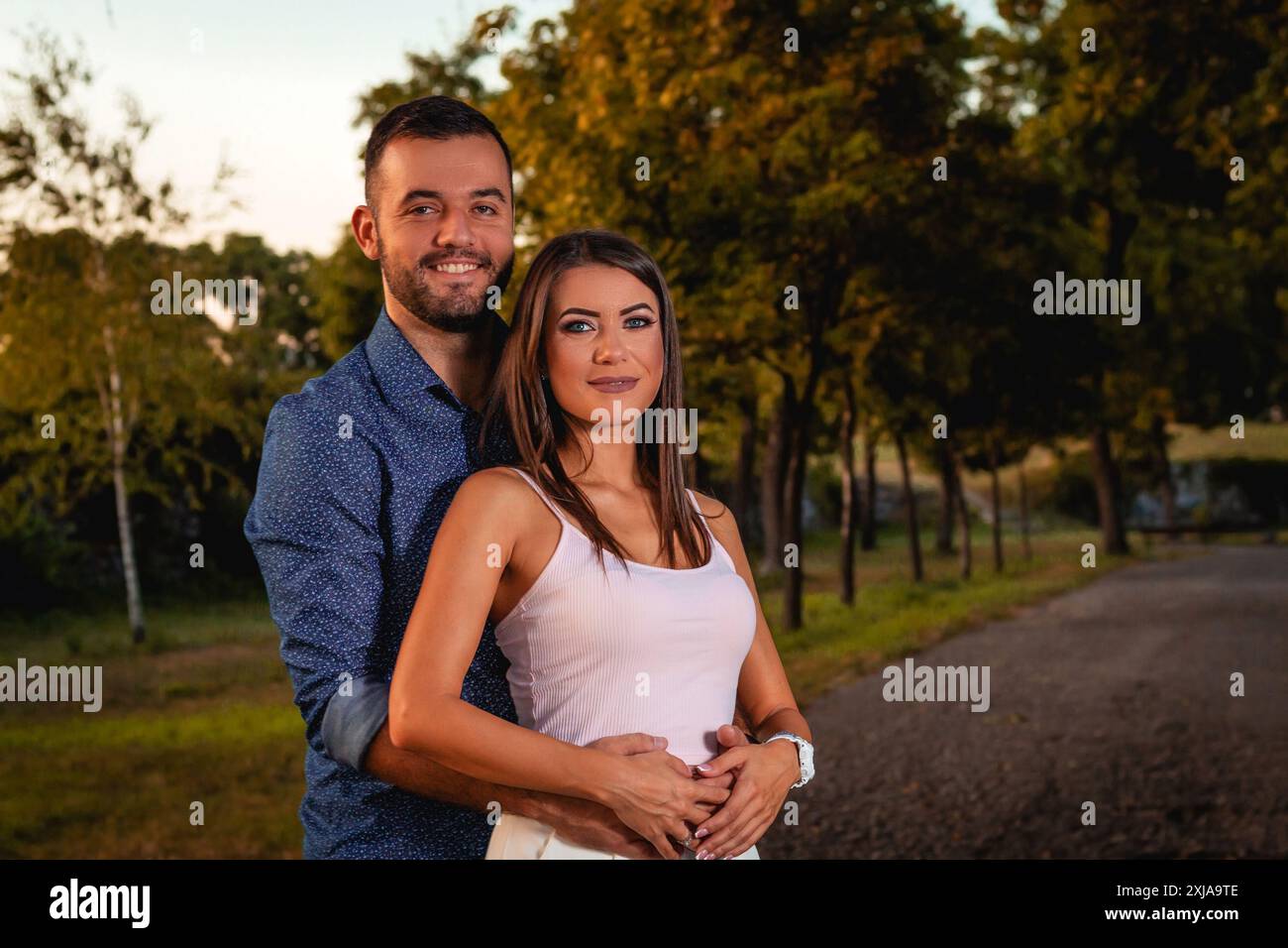 Mans arm around woman waist hi-res stock photography and images - Alamy