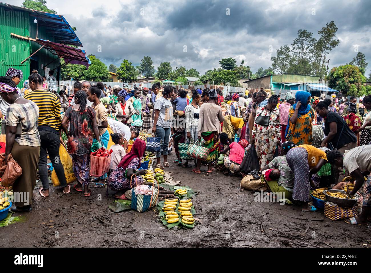 Busy African open market offering vegetables, wooden products and ...