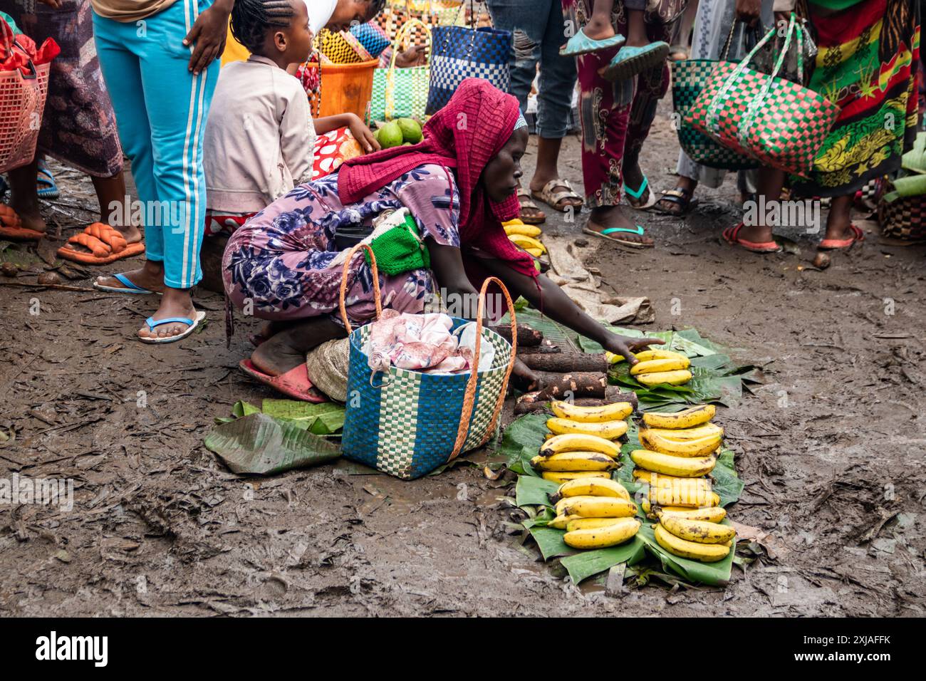 An African open market buzzes with activity on a rainy day, as many ...