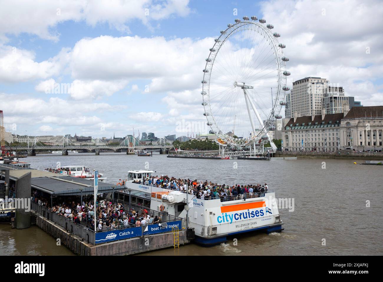 People queue and wait for a boat ride in London as many tourists are ...