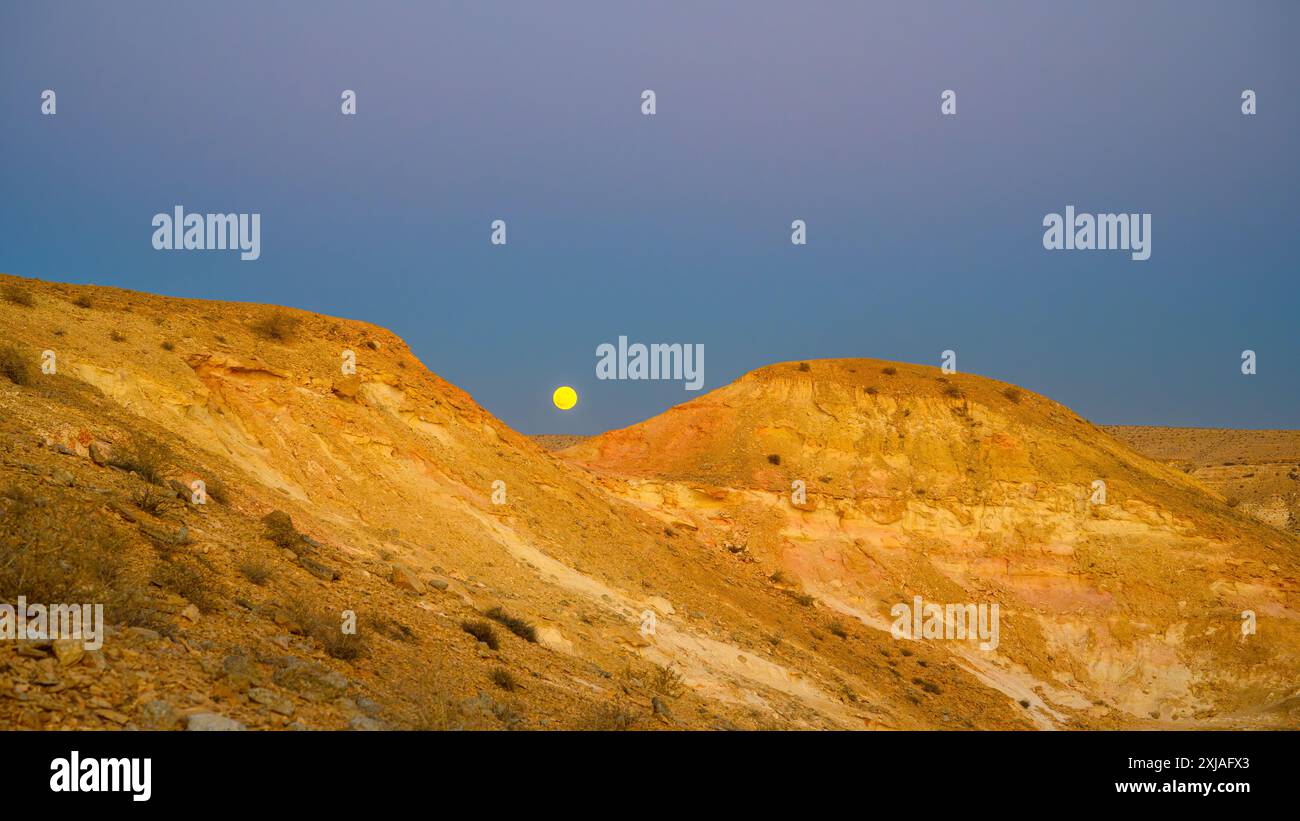 full moon moon rising over the Negev Desert landscape Photographed at Havarim stream (Near ...