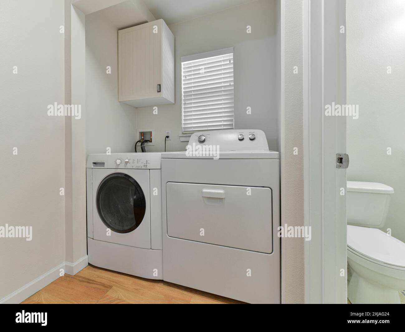 Modern residential laundry room interior Stock Photo - Alamy