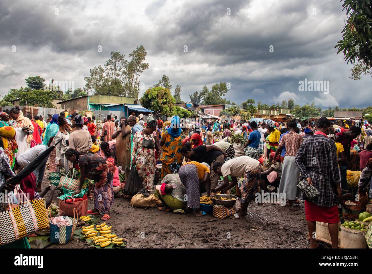 Busy African open market offering vegetables, wooden products and ...